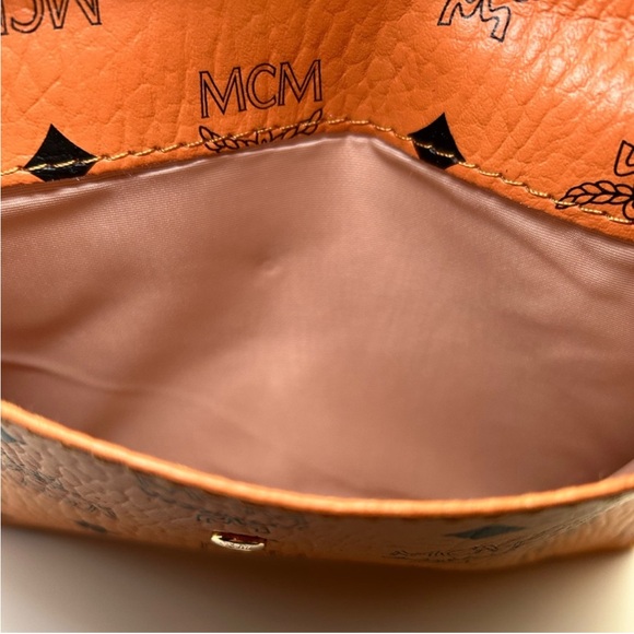 MCM | Bags | Luxury Cognac Monogram Envelope Pouch Slim Travel Clutch ...